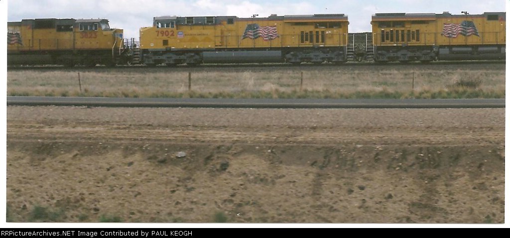 UP 7902 rolls west behind UP 7807 on her first ride west.